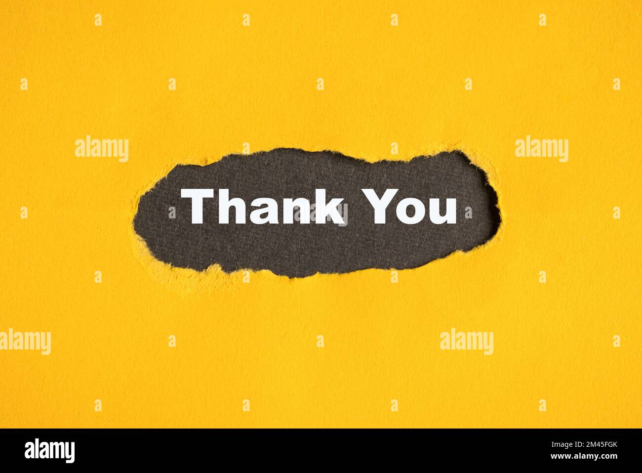 Torn yellow paper with Thank you text on black background Stock Photo ...