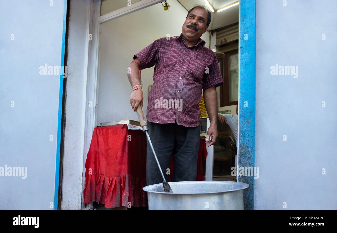Owner of a sweet shop known as a Halwai making Gulab jamun, a popular ...