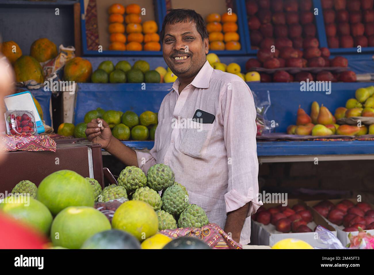 Fruit vendour Selling Fruits at the Market Stock Photo - Alamy