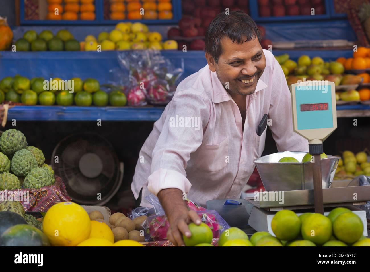 Fruit vendour Selling Fruits at the Market Stock Photo - Alamy
