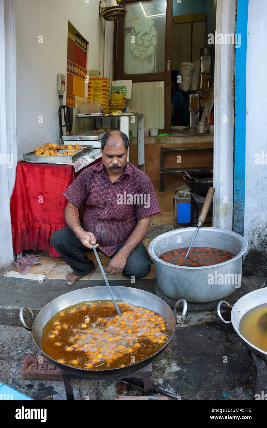 Owner of a sweet shop known as a Halwai making Gulab jamun, a popular ...