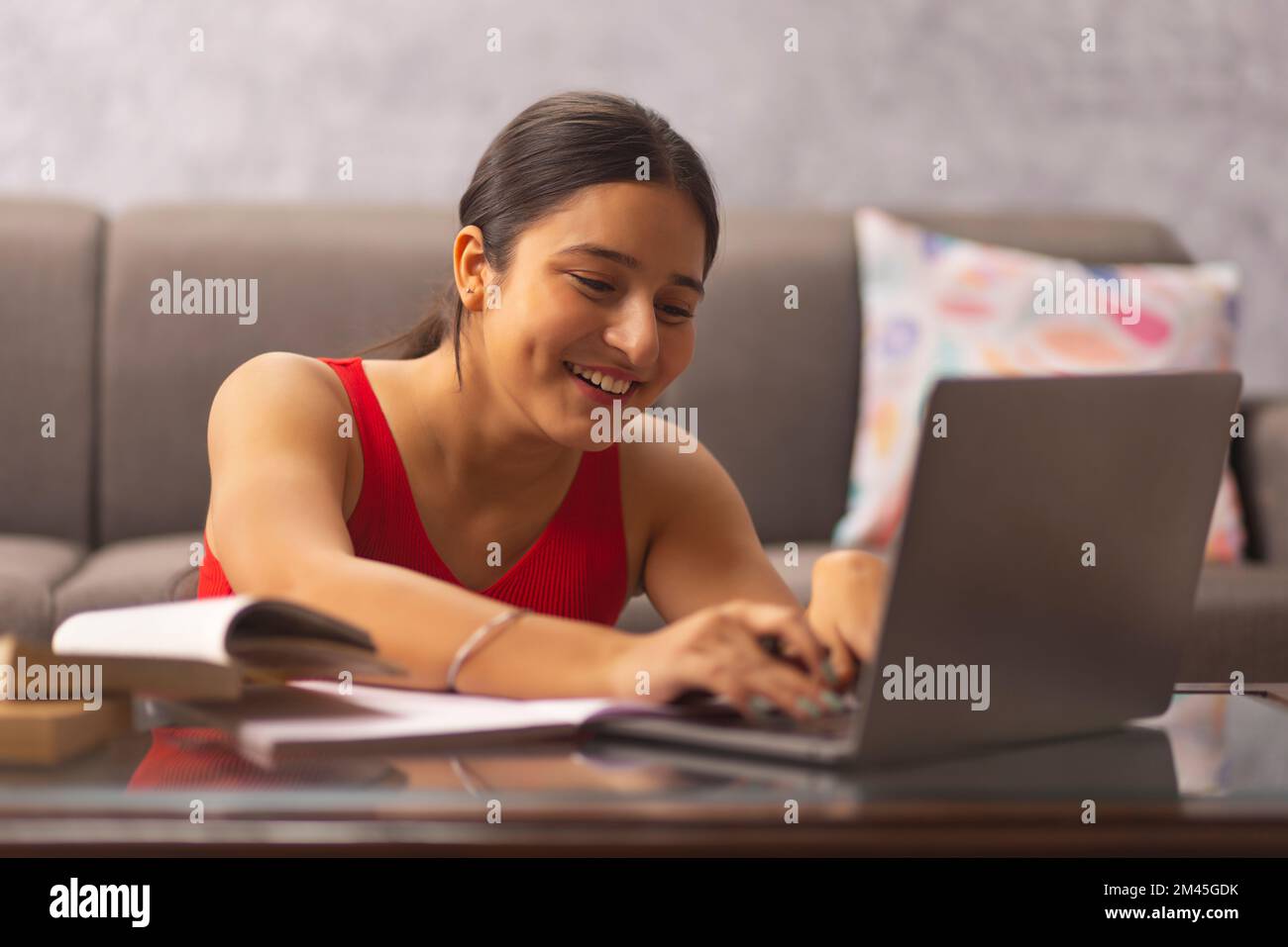 Portrait of a teenage girl doing homework during online classes Stock ...