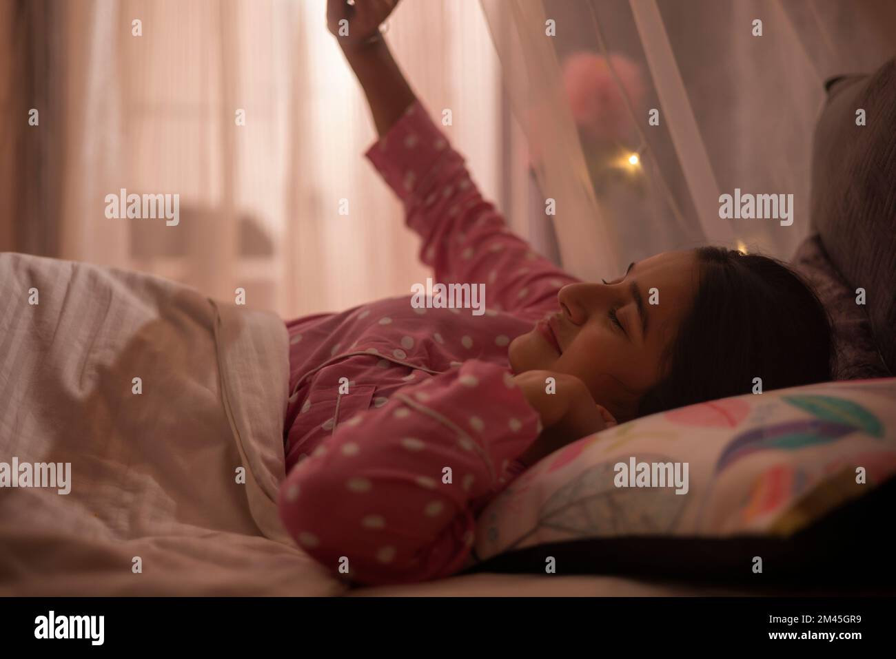 Beautiful teenage girl waking up after night sleep Stock Photo - Alamy