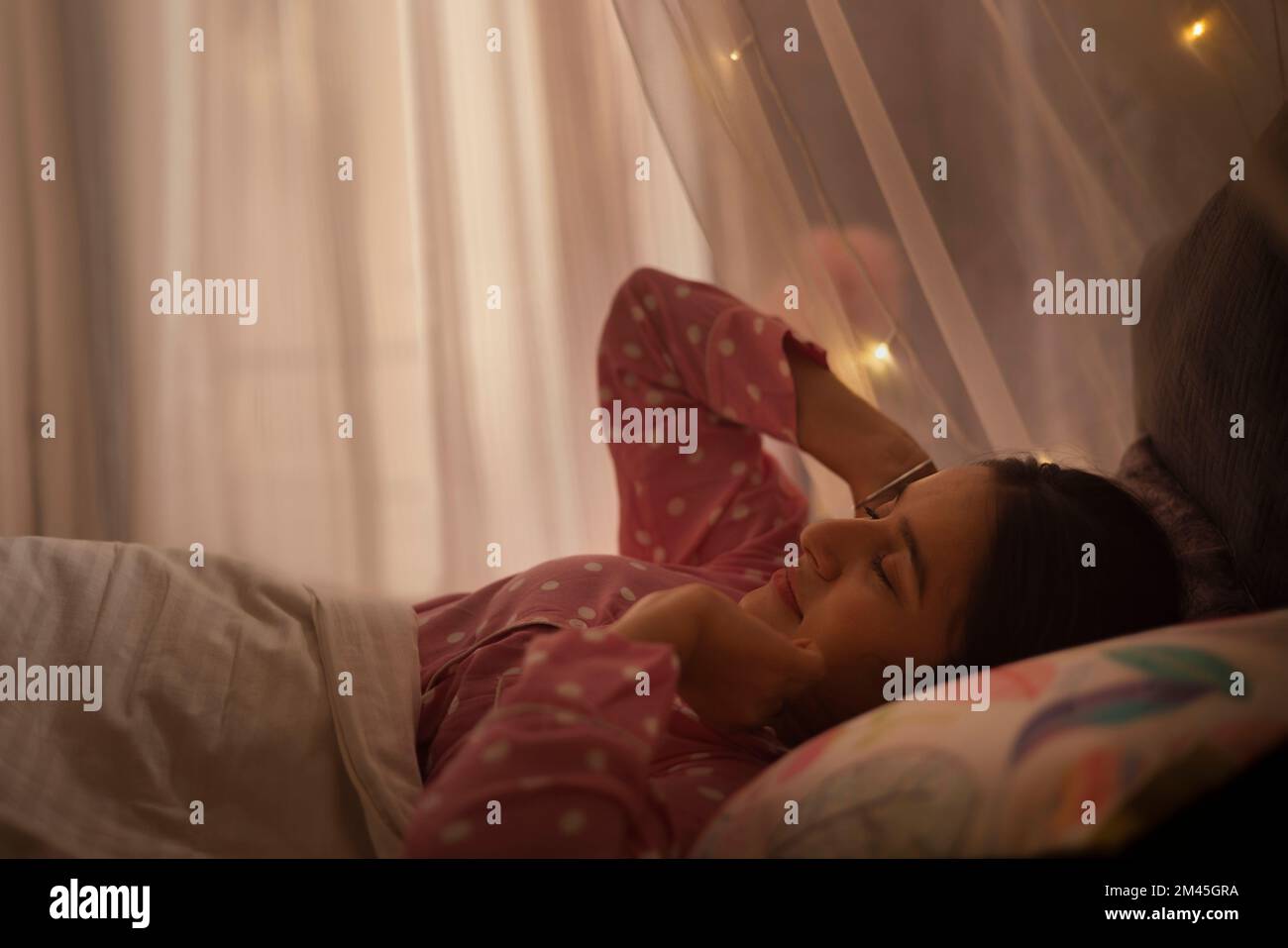 Beautiful teenage girl waking up after night sleep Stock Photo - Alamy