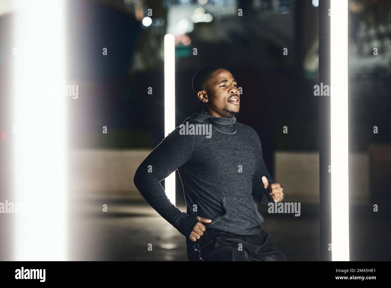 African runner man, night and city for training, speed exercise or ...