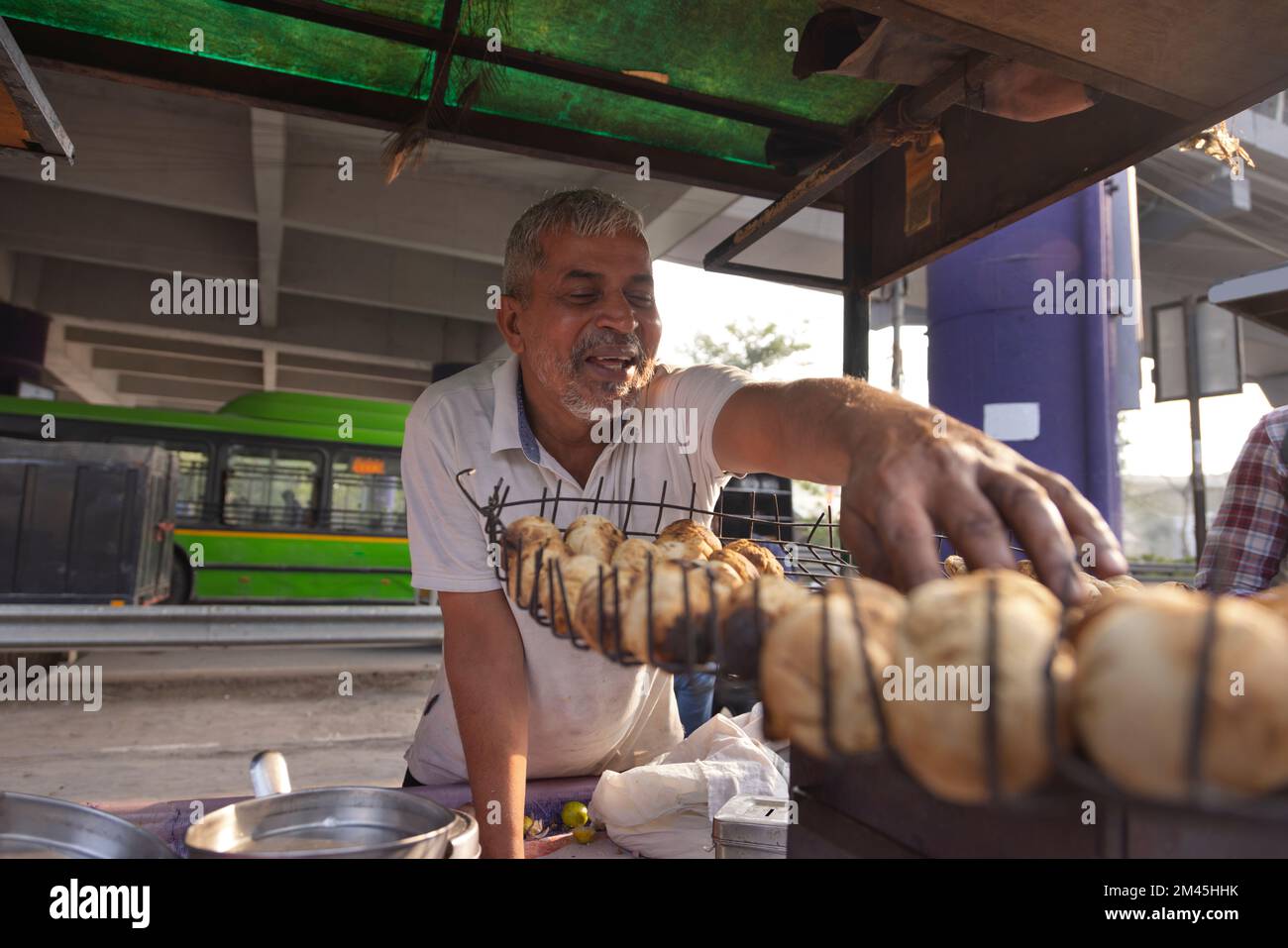 Male vendor making litti at his roadside food stall Stock Photo - Alamy