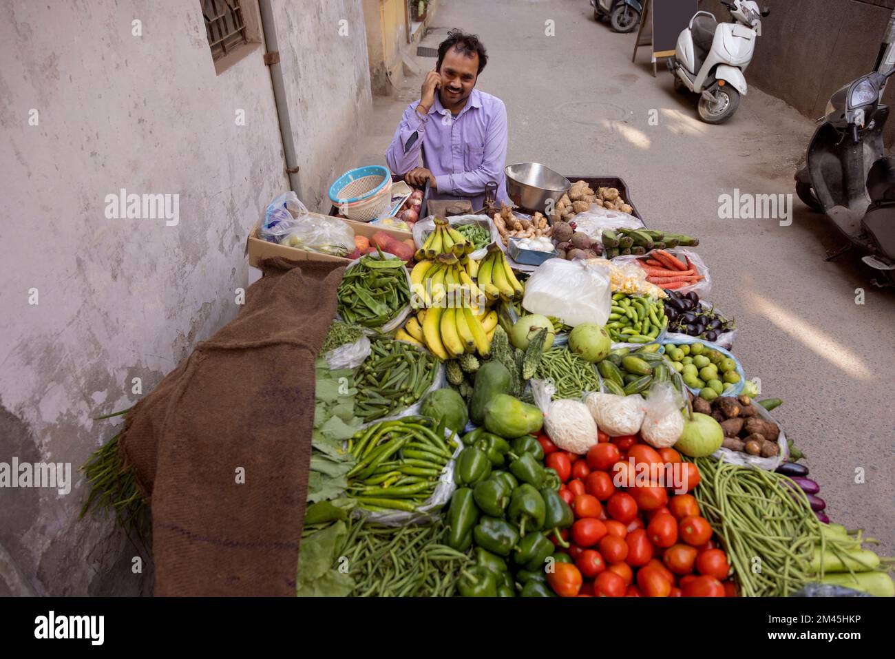 Male vendor selling various vegetables at his roadside stall Stock ...