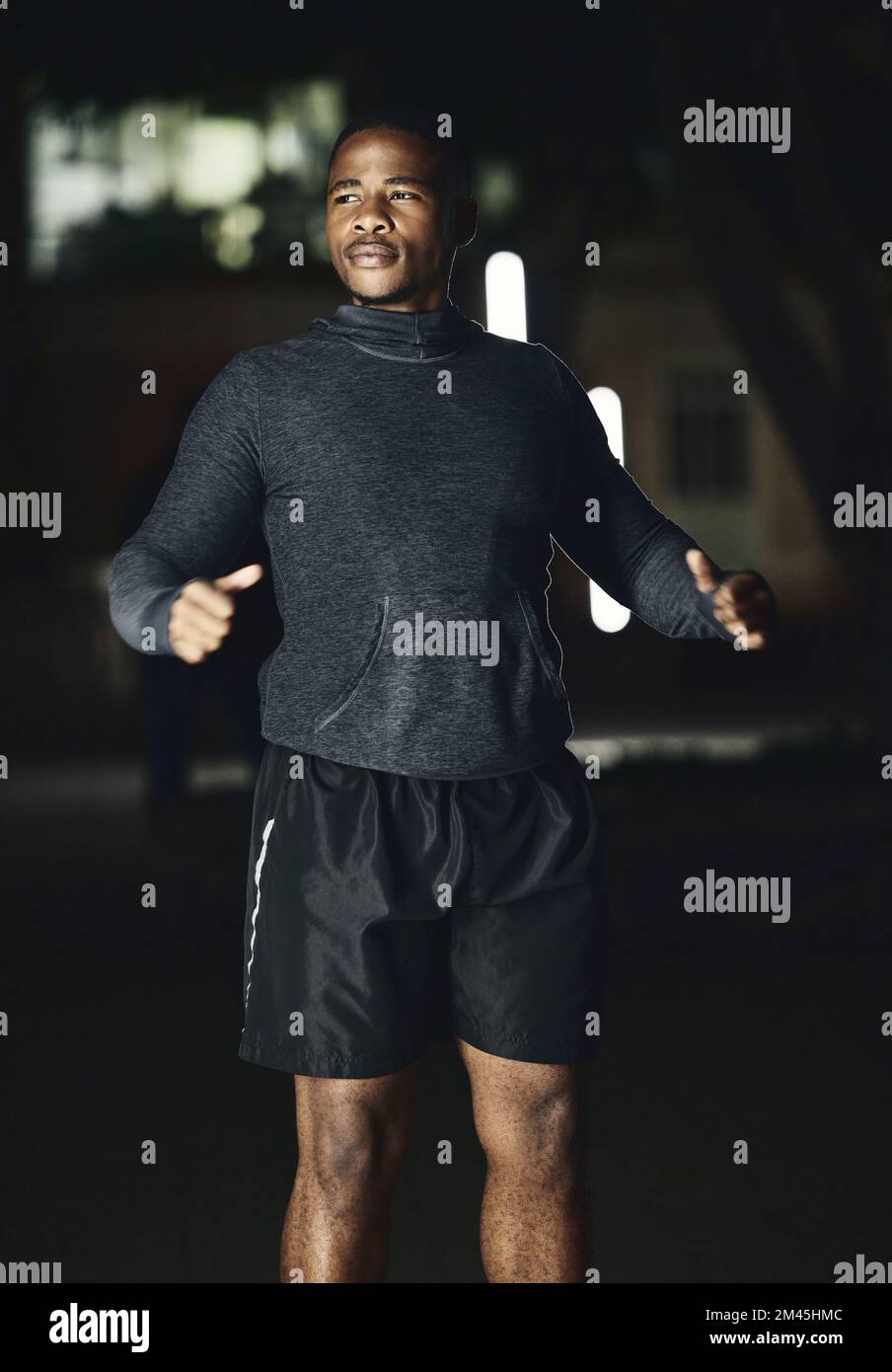 Fitness, night or black man ready for running exercise, cardio training ...