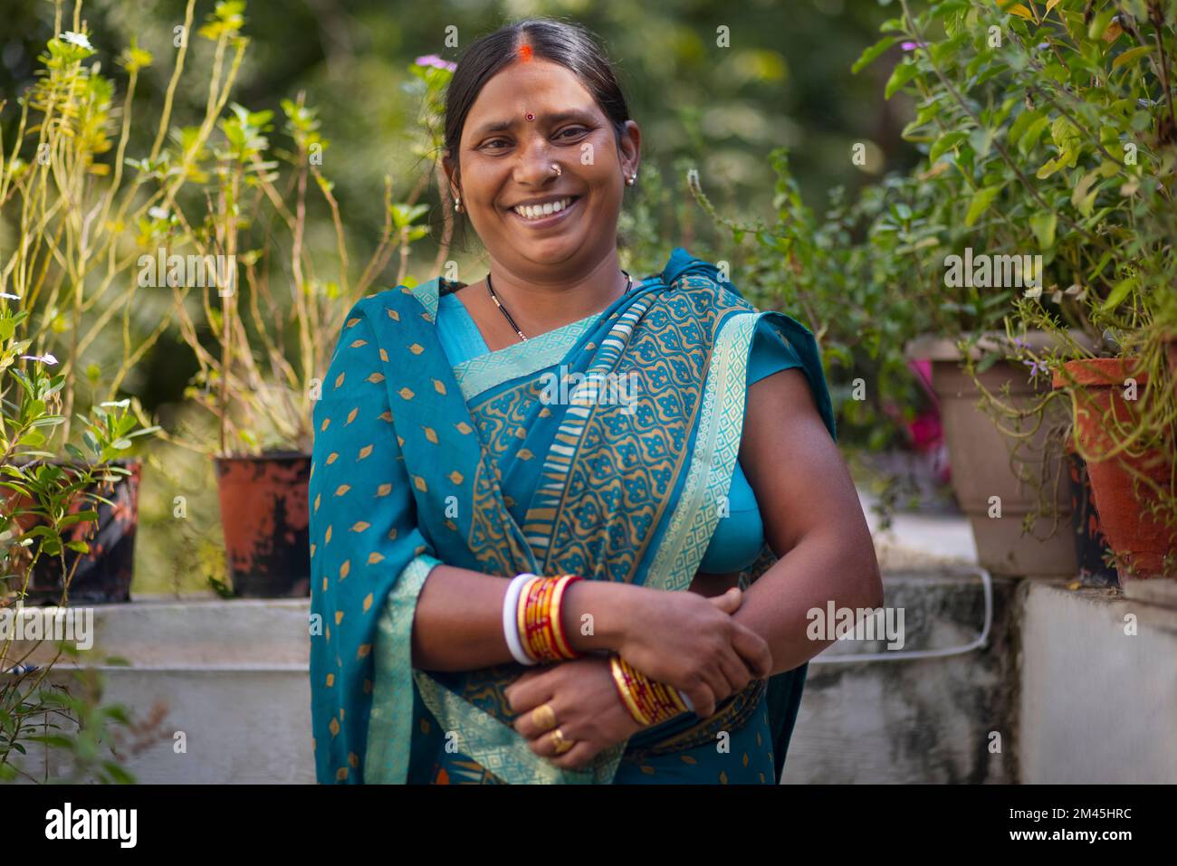 portrait of a smiling indian house maid Stock Photo - Alamy