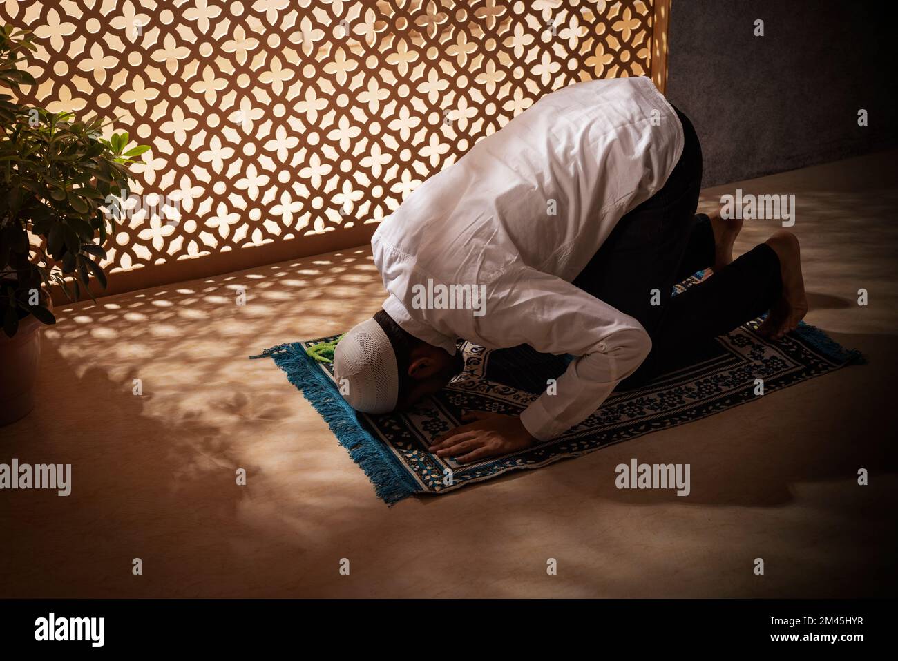 Portrait of a Muslim man praying at home Stock Photo - Alamy
