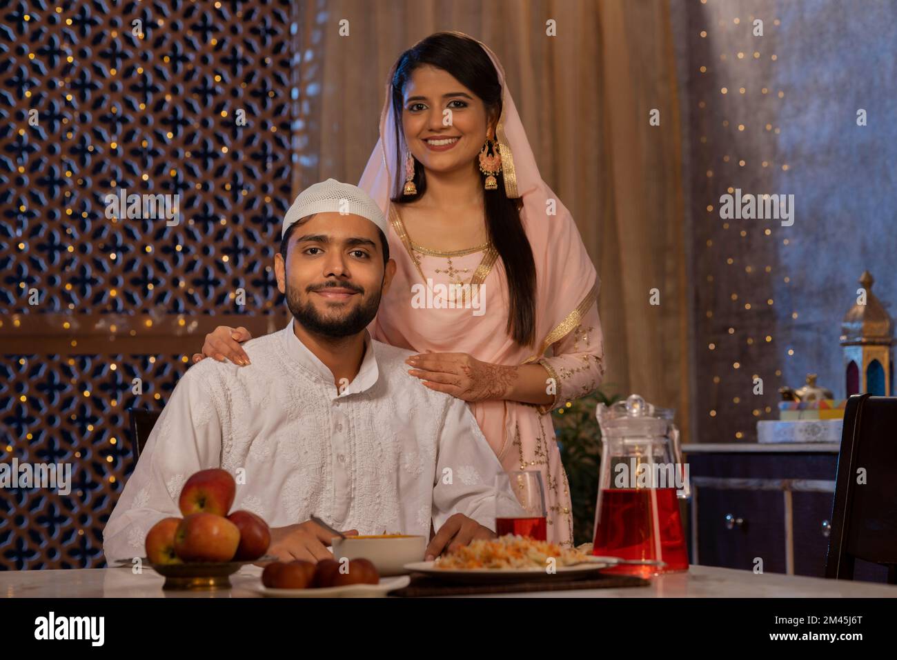 Portrait of happy Muslim couple looking at camera with smile Stock ...