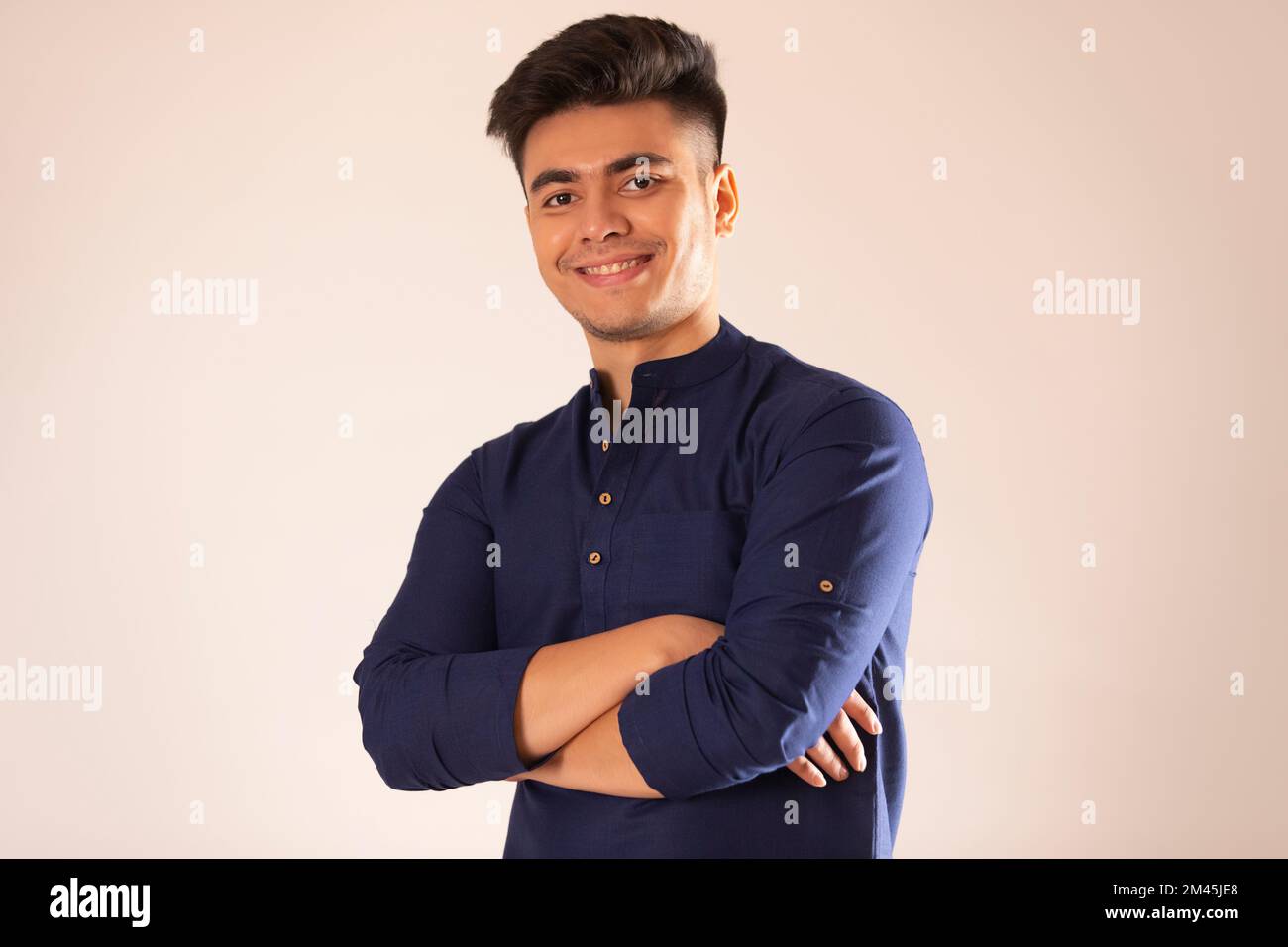 Young man side view crossed arms hi-res stock photography and images ...
