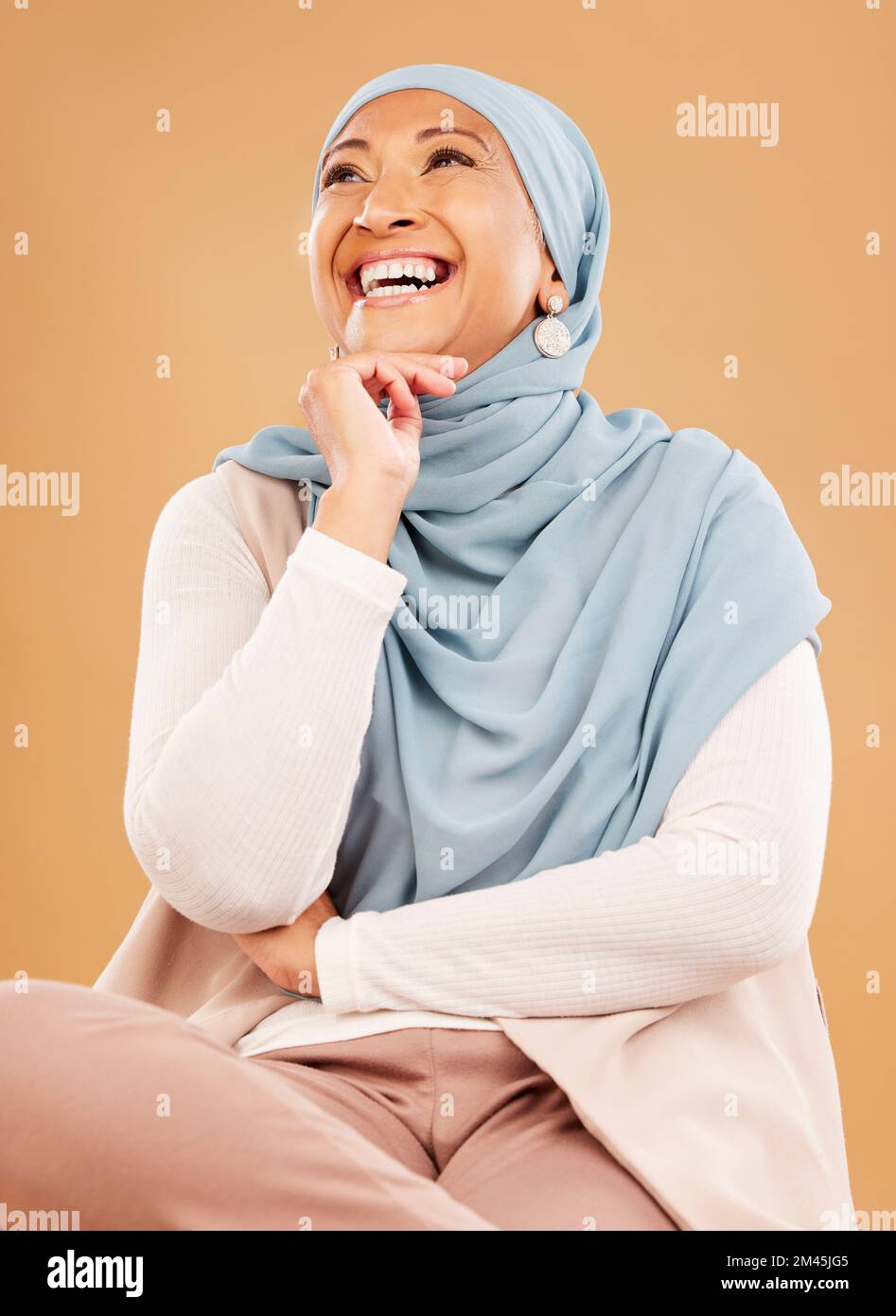 Muslim, woman and smile for happy thoughts on a studio background while ...