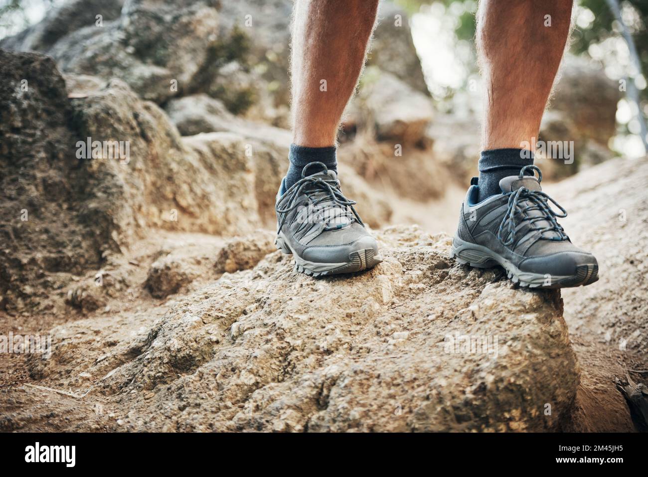 These rocks wont stop me. Low angle shot of an unrecognizable man ...