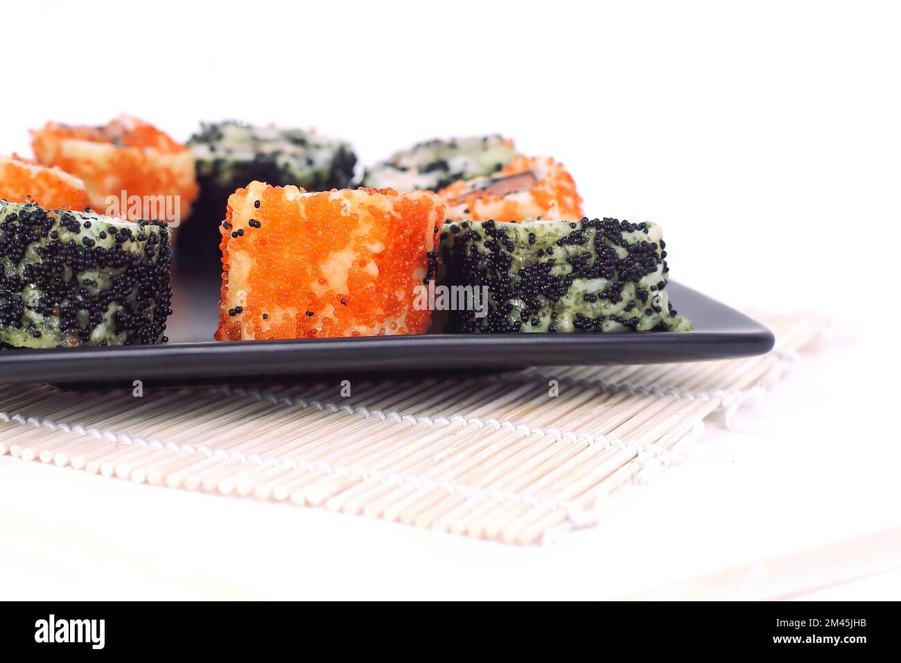 different types of Maki sushi on a black plate Stock Photo - Alamy