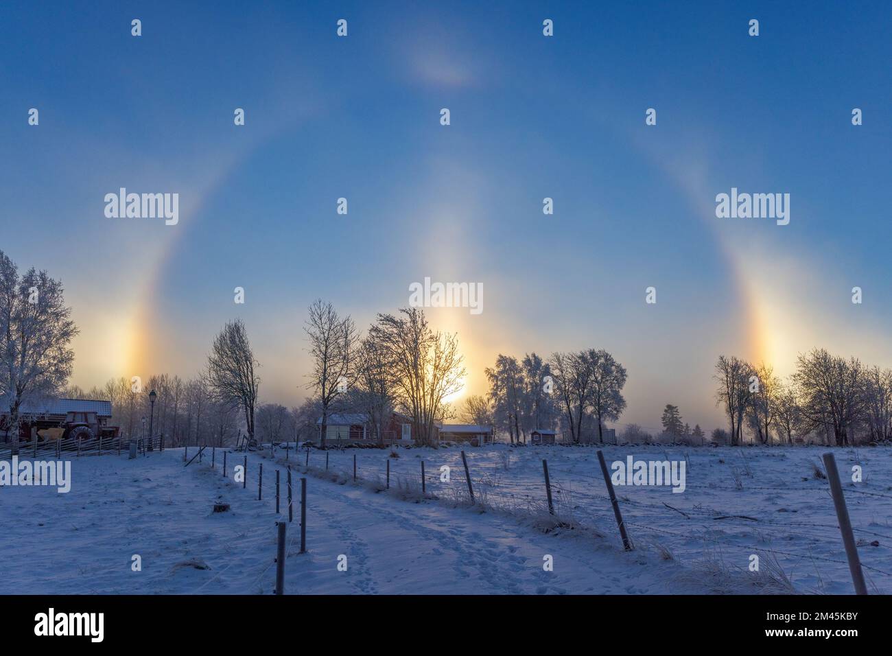 Winter day with Sun halo and sun dogs in the countryside Stock Photo ...