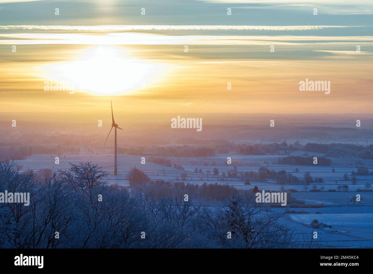 Wind turbines in a cold winter landscape at dusk Stock Photo - Alamy