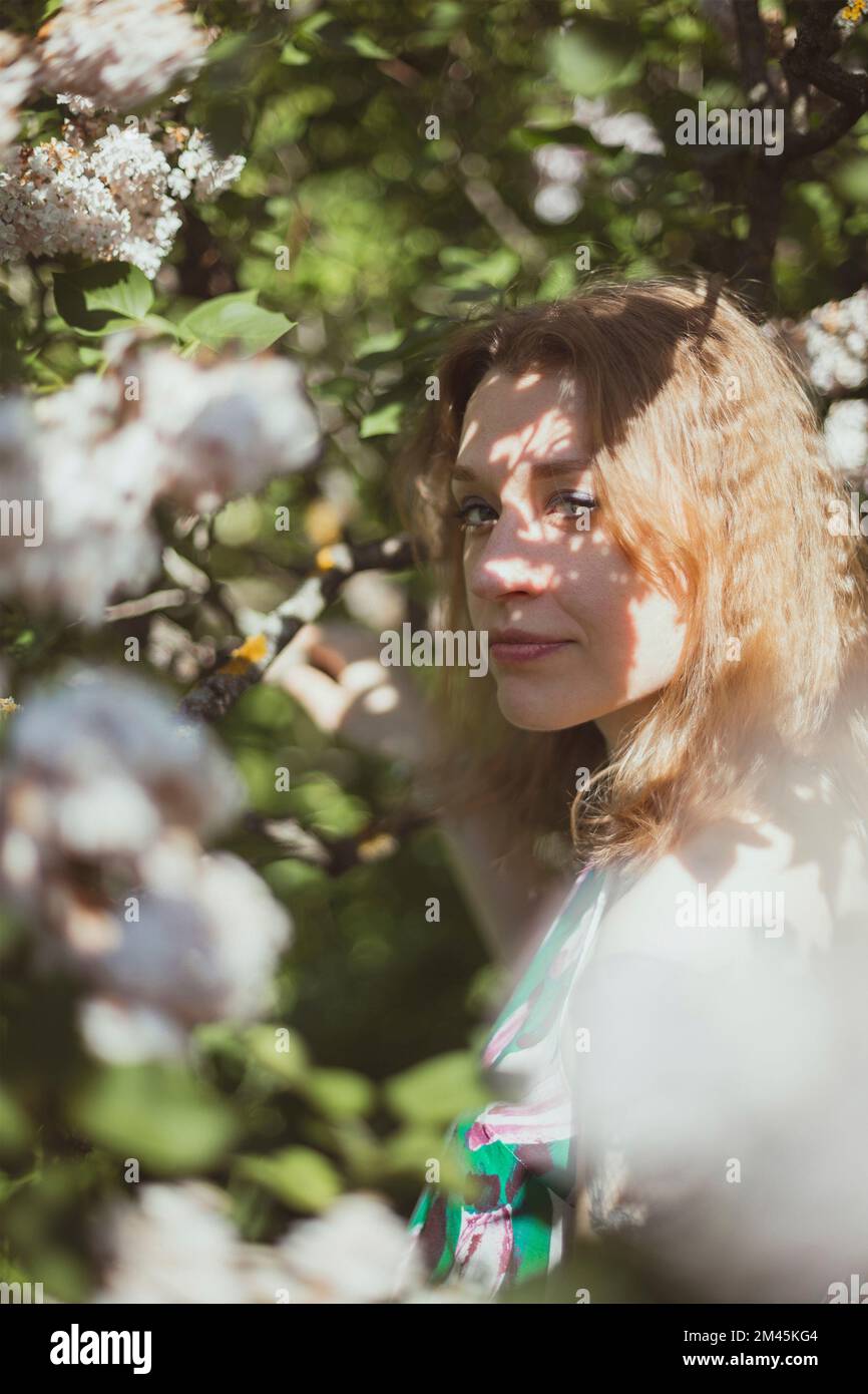 Close up sunlight shining through leaves on woman face portrait picture ...