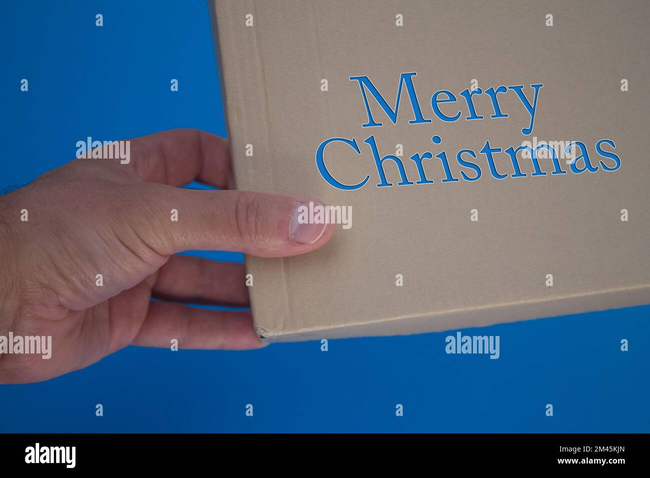 Merry Christmas word with cardboard box. Brown folded card box Stock ...