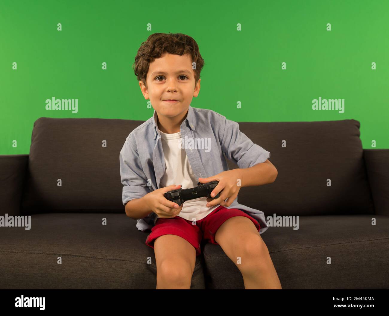 Boy playing video games Stock Photo - Alamy