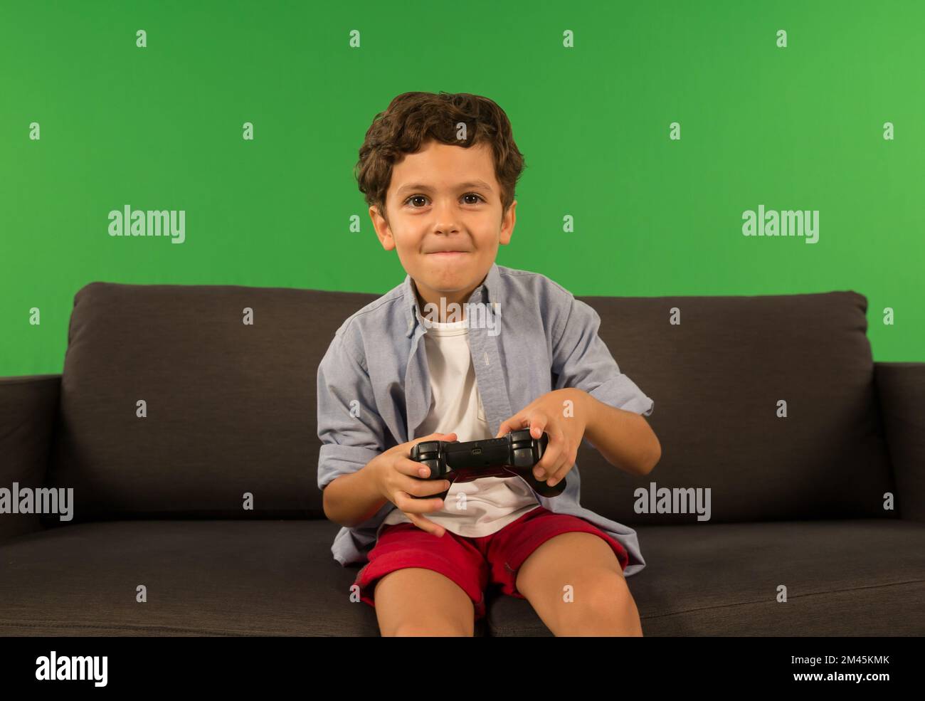 Boy playing video games Stock Photo - Alamy