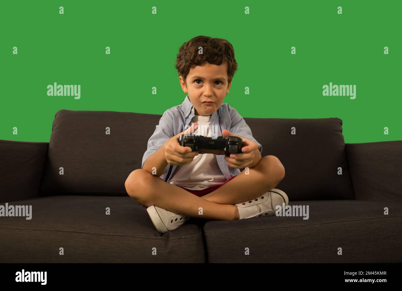 Boy playing video games Stock Photo - Alamy