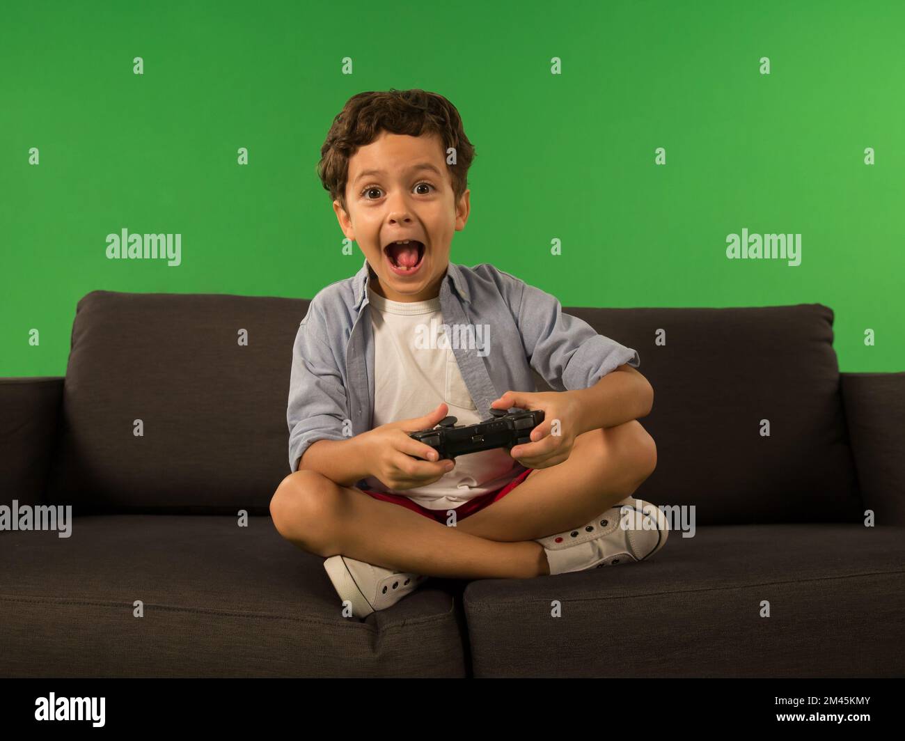 Boy playing video games Stock Photo - Alamy
