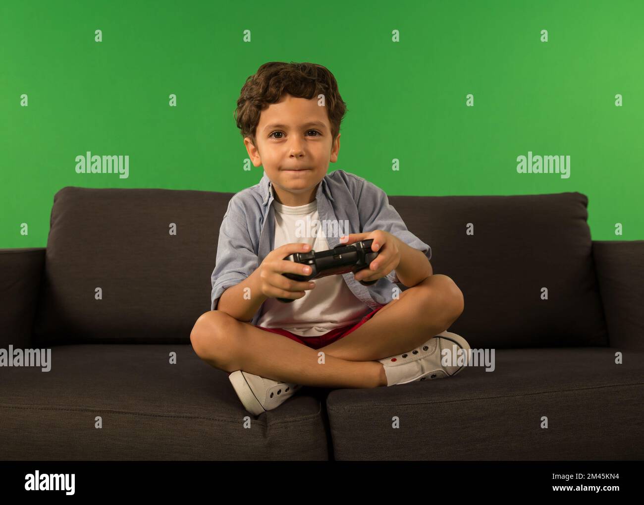 Boy playing video games Stock Photo - Alamy