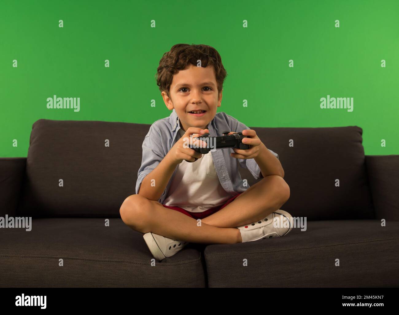 Boy playing video games Stock Photo - Alamy