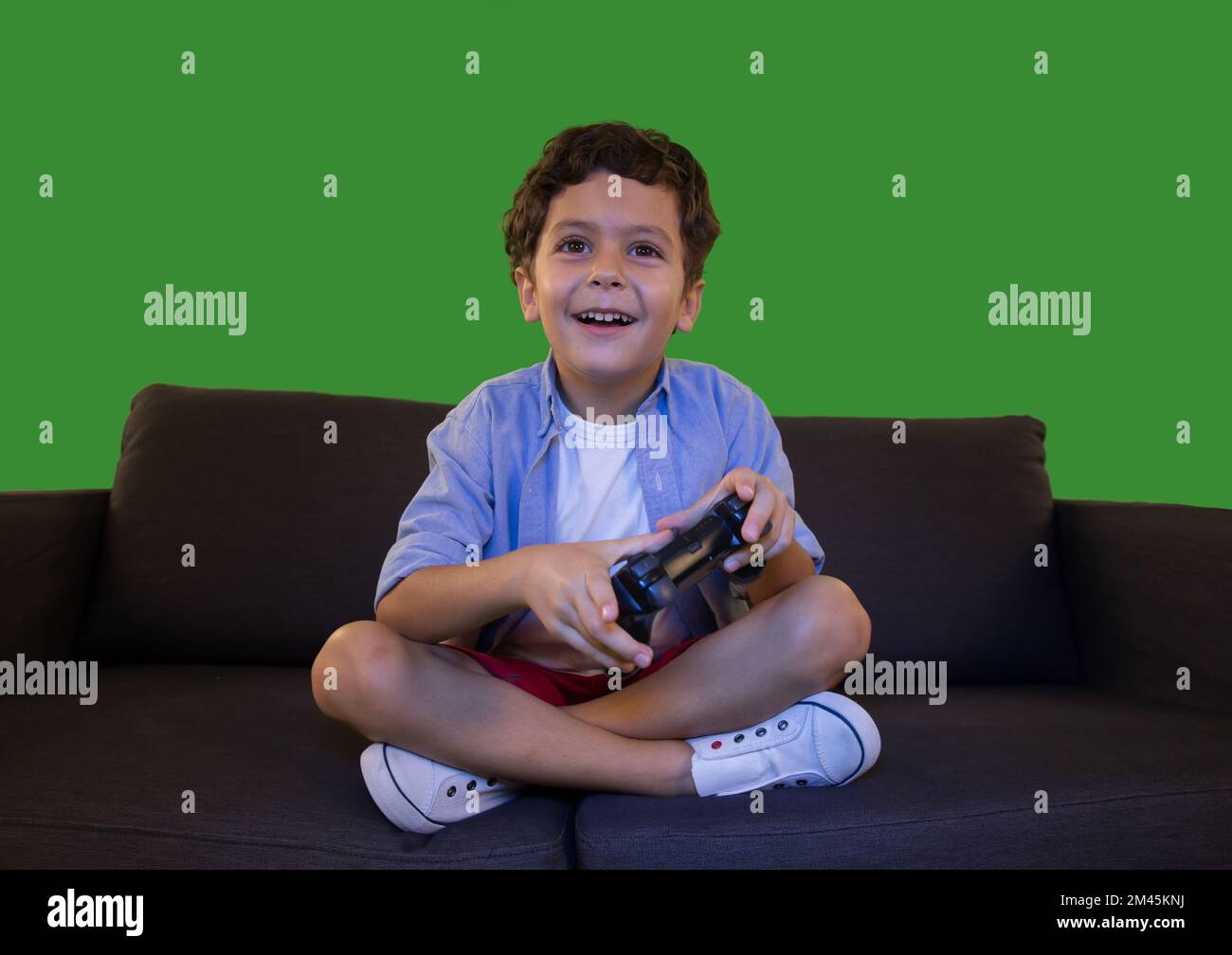 Boy playing video games Stock Photo - Alamy