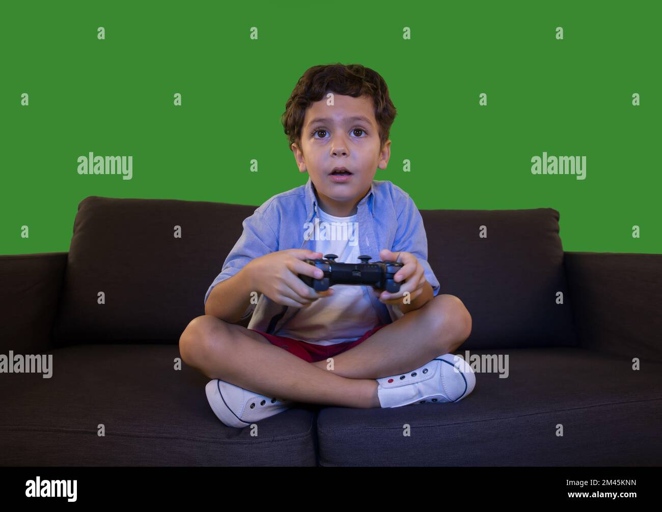 Boy playing video games Stock Photo - Alamy