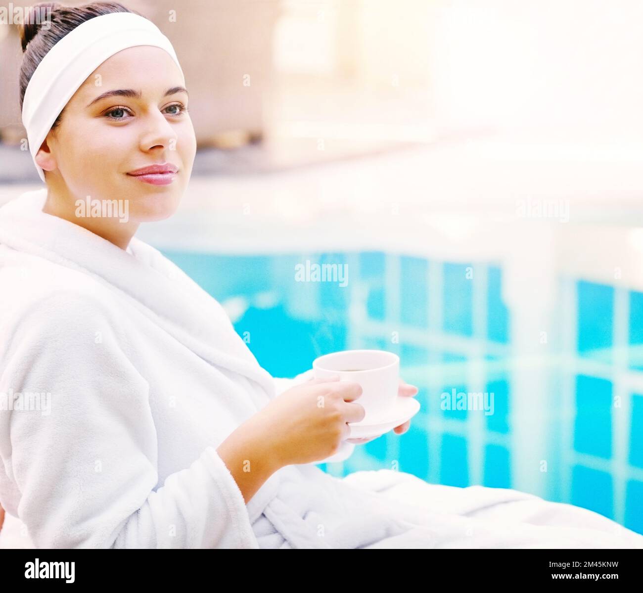 This day couldnt get any better. a young woman drinking a cup of tea ...