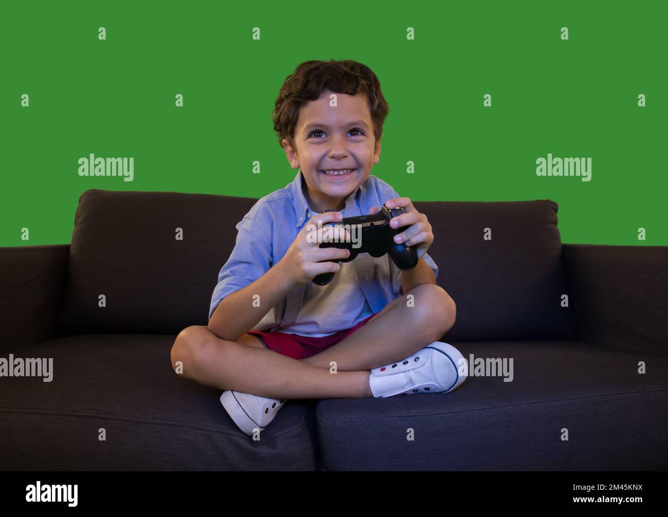 Boy playing video games Stock Photo - Alamy