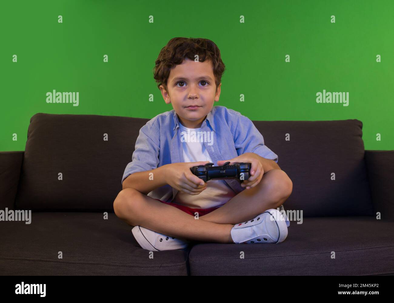 Boy playing video games Stock Photo - Alamy