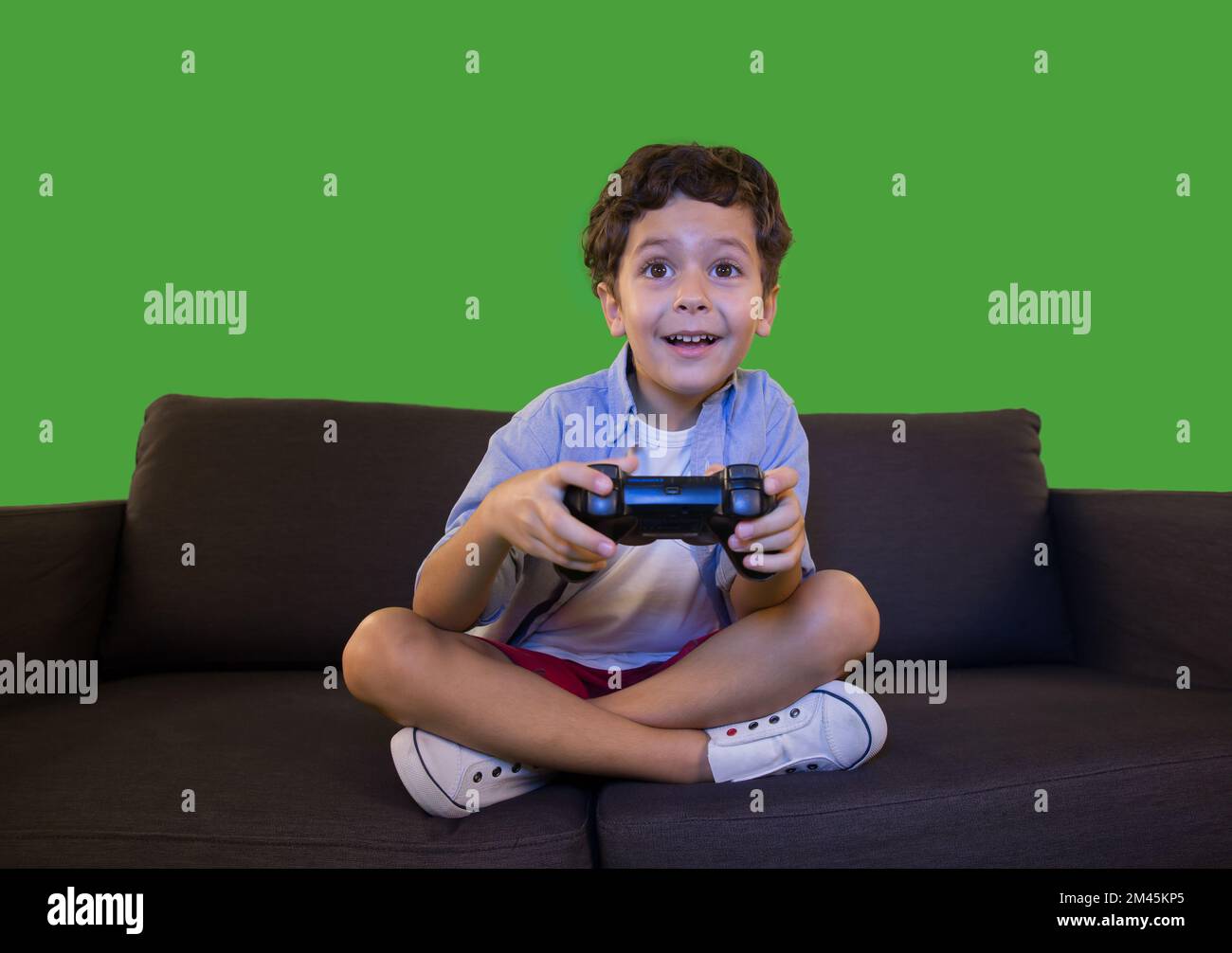 Boy playing video games Stock Photo - Alamy