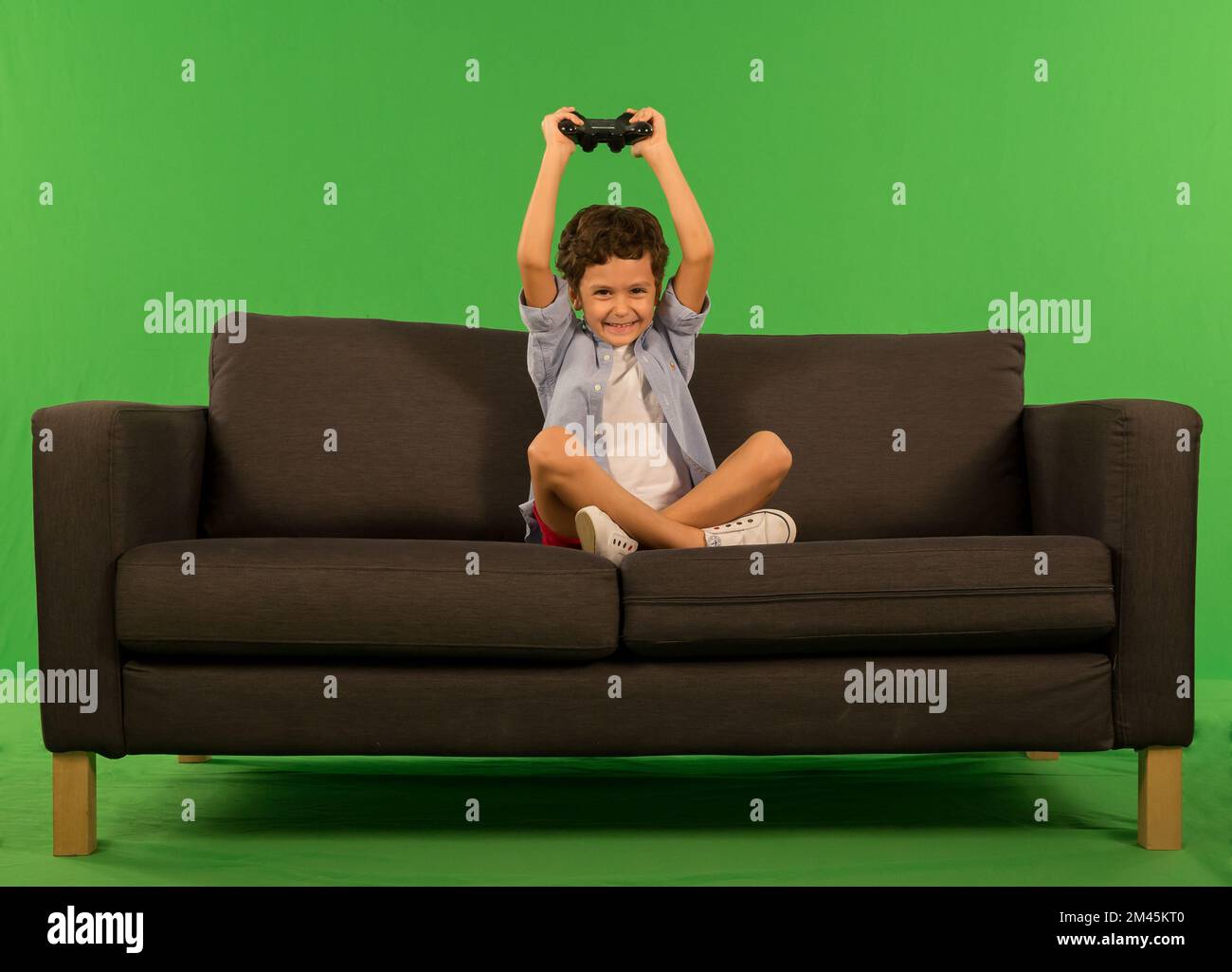 Boy playing video games Stock Photo - Alamy