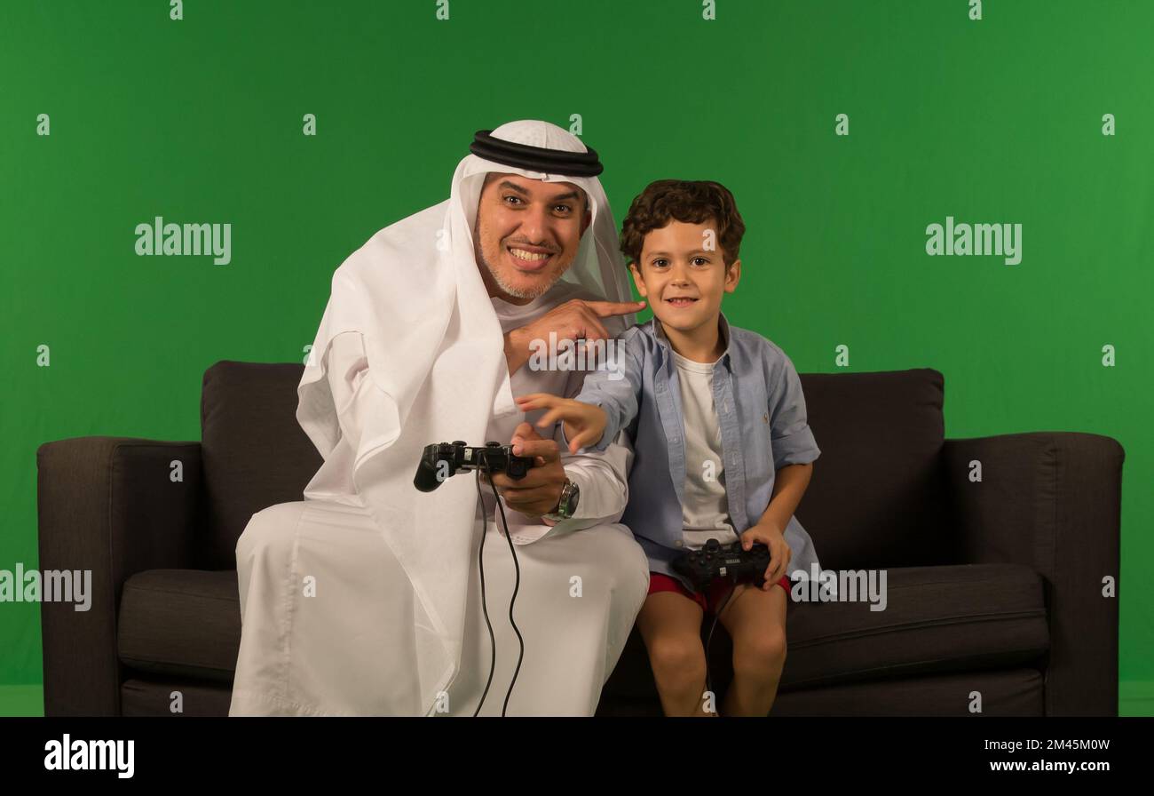 Arab boy playing video game hi-res stock photography and images - Alamy
