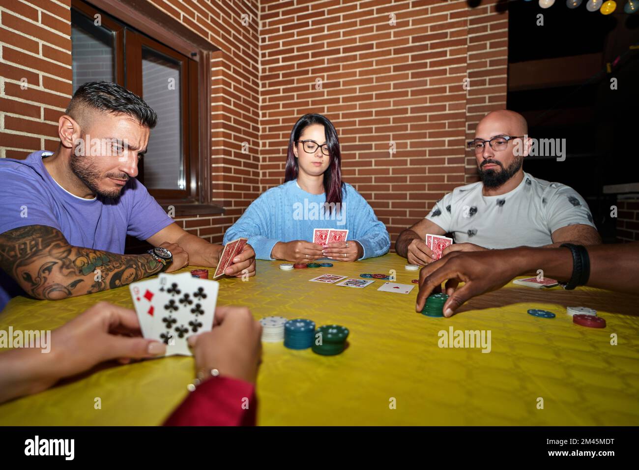 Woman looking at playing cards hi-res stock photography and images - Alamy