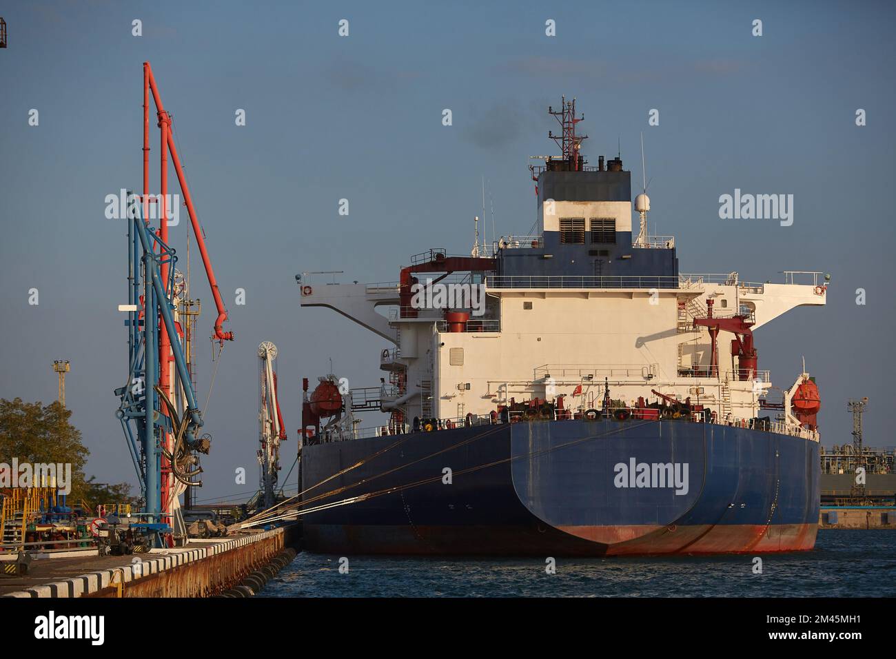 Oil tanker at the port terminal. Tanker in port at oil terminal Stock ...