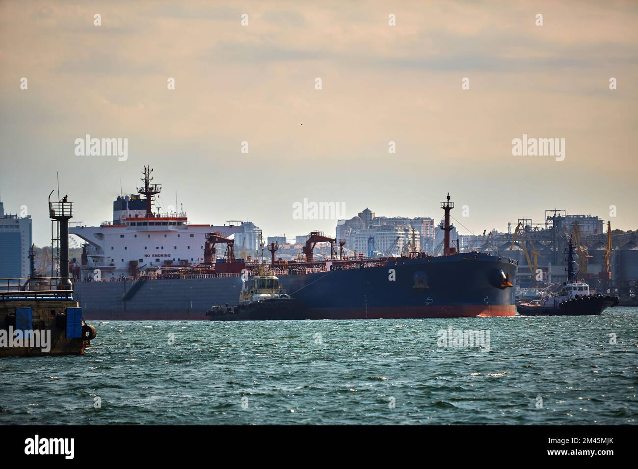 Oil tanker at the port terminal. Tanker in port at oil terminal Stock ...
