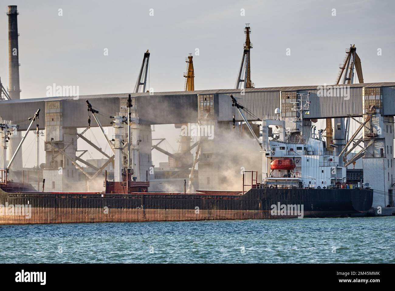 Port grain elevator. Industrial sea trading port bulk cargo zone ...
