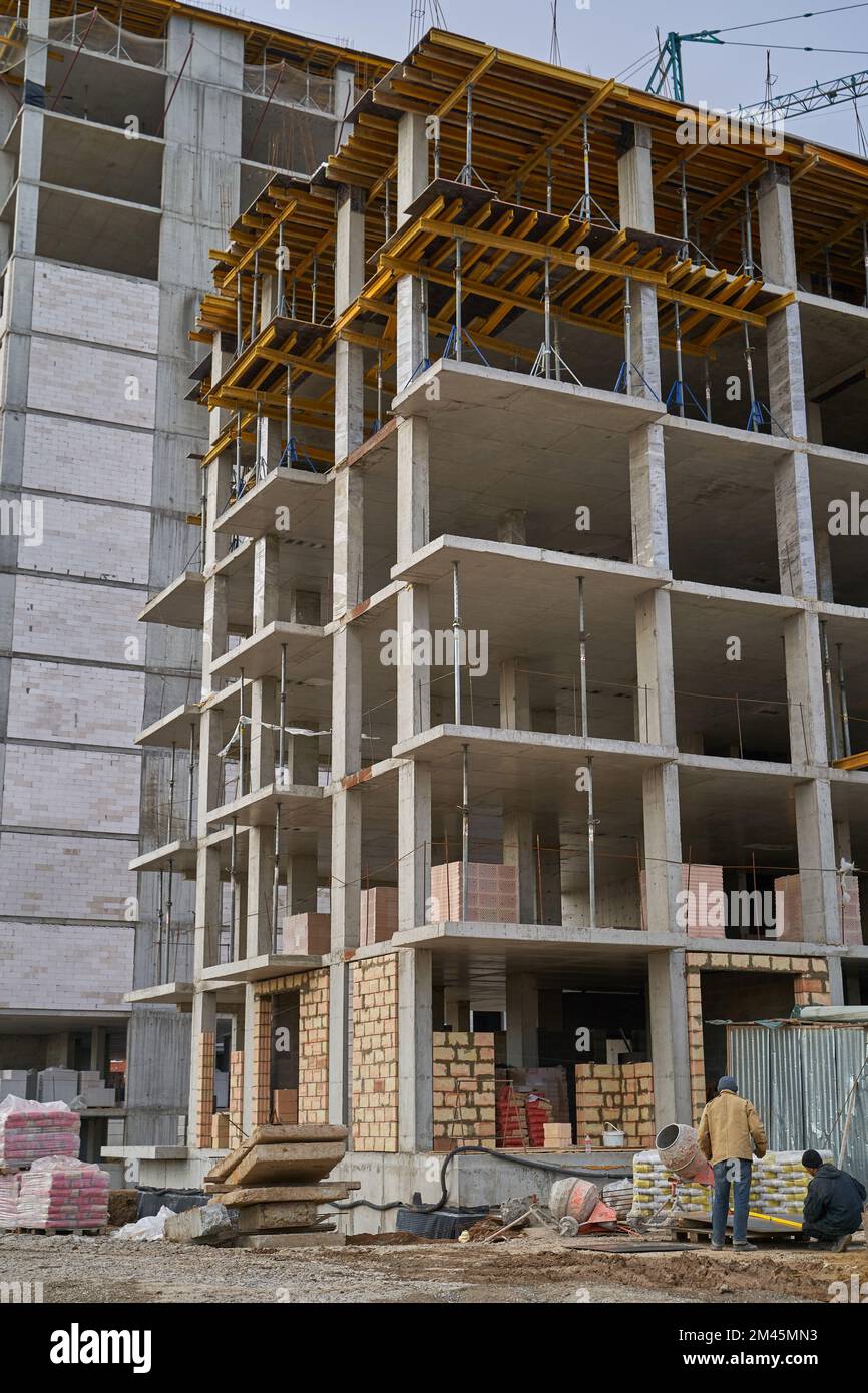 Construction site. High rise Building under construction. Construction ...
