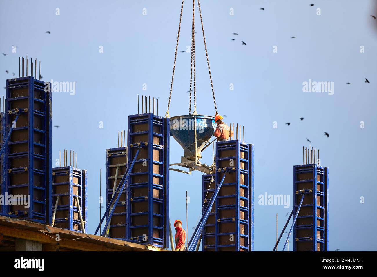 Pouring concrete on the construction of a high-rise building Stock ...