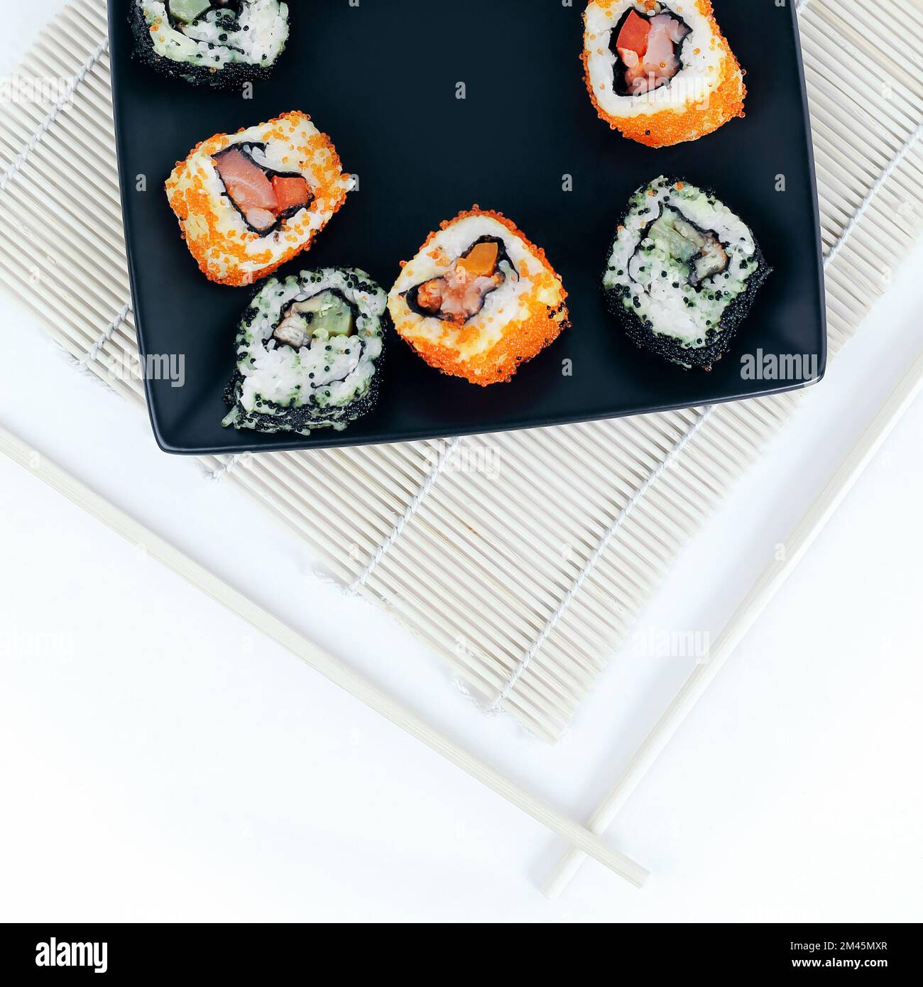 different types of Maki sushi on a black plate Stock Photo - Alamy