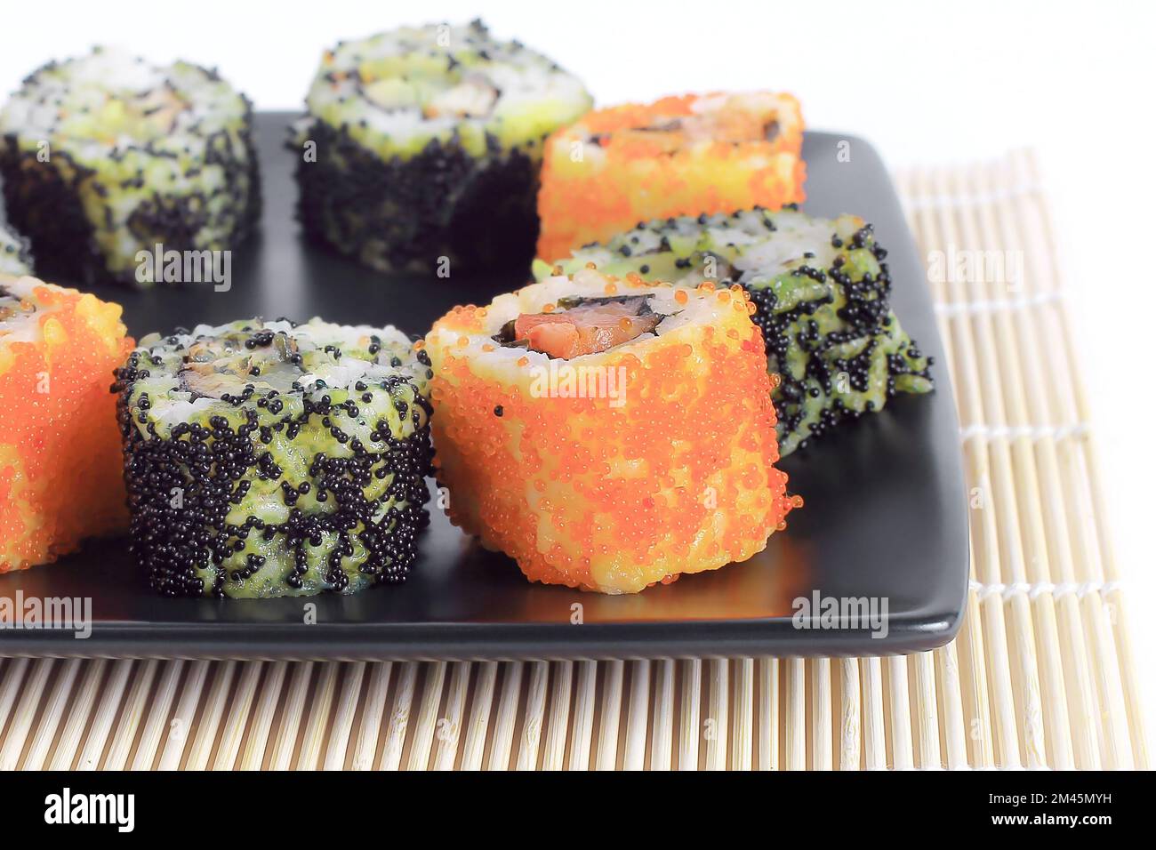 Sushi Set - different types of Maki sushi and chopsticks on a b Stock ...