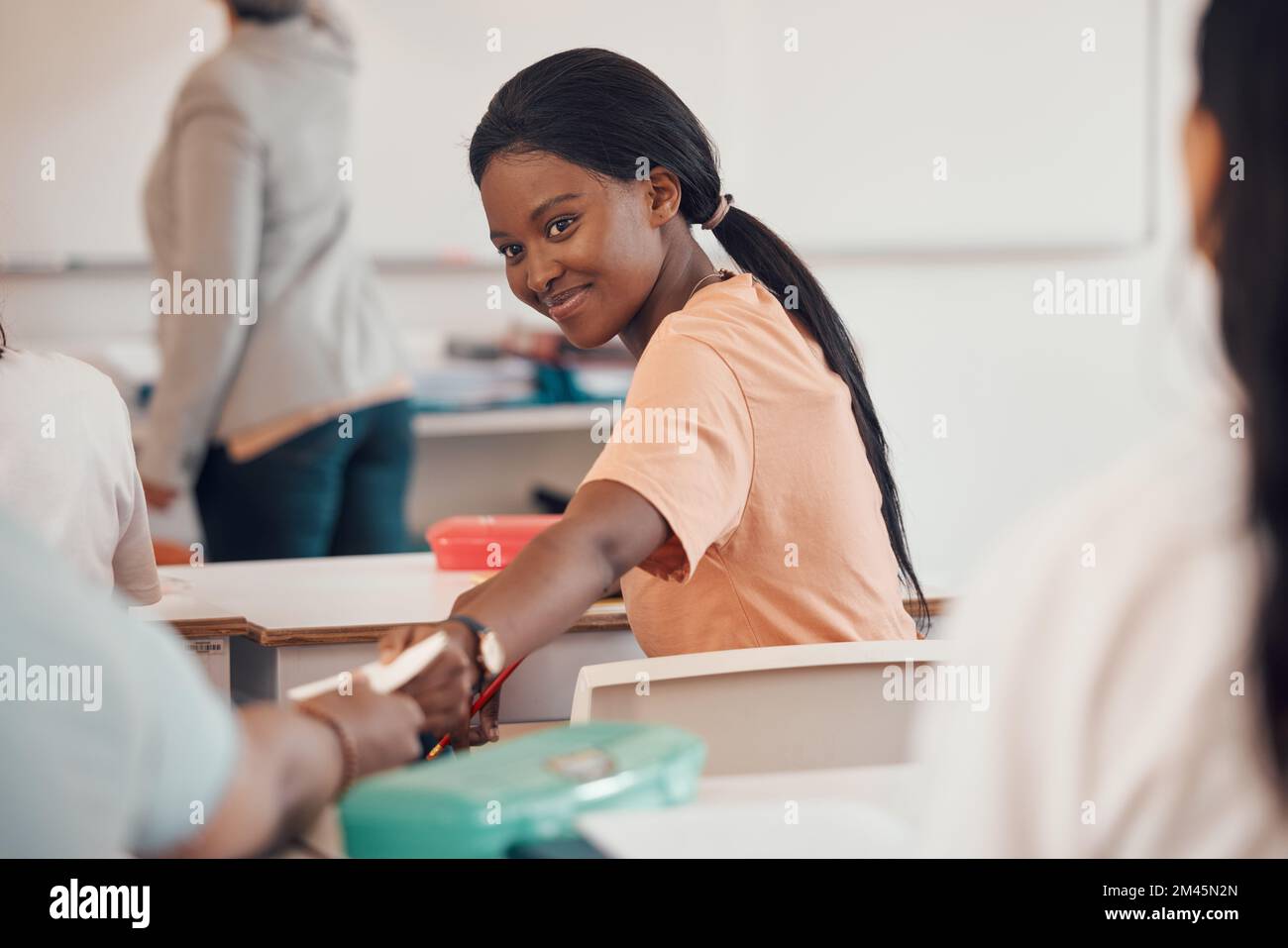 Girl, teenager or passing note in classroom for secret gossip, news or ...