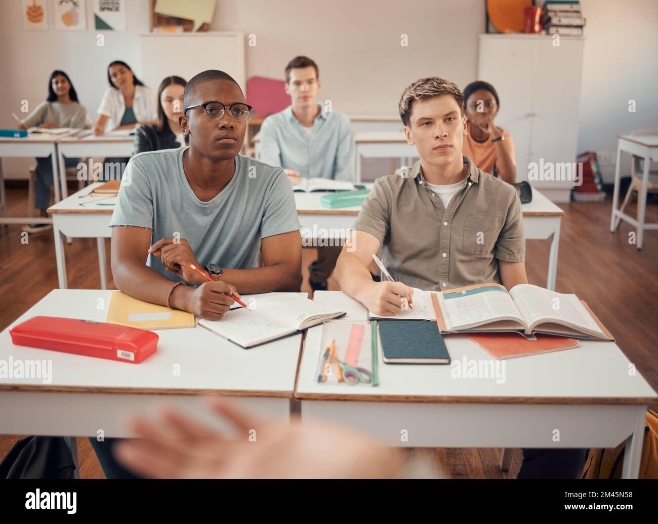 High school, students and boys listening in classroom of education ...