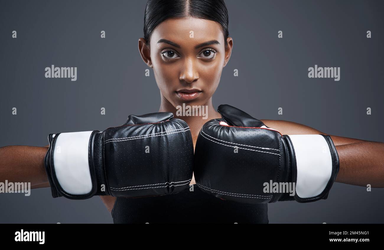 Theres a fighter within all of us. Studio portrait of a sporty young ...