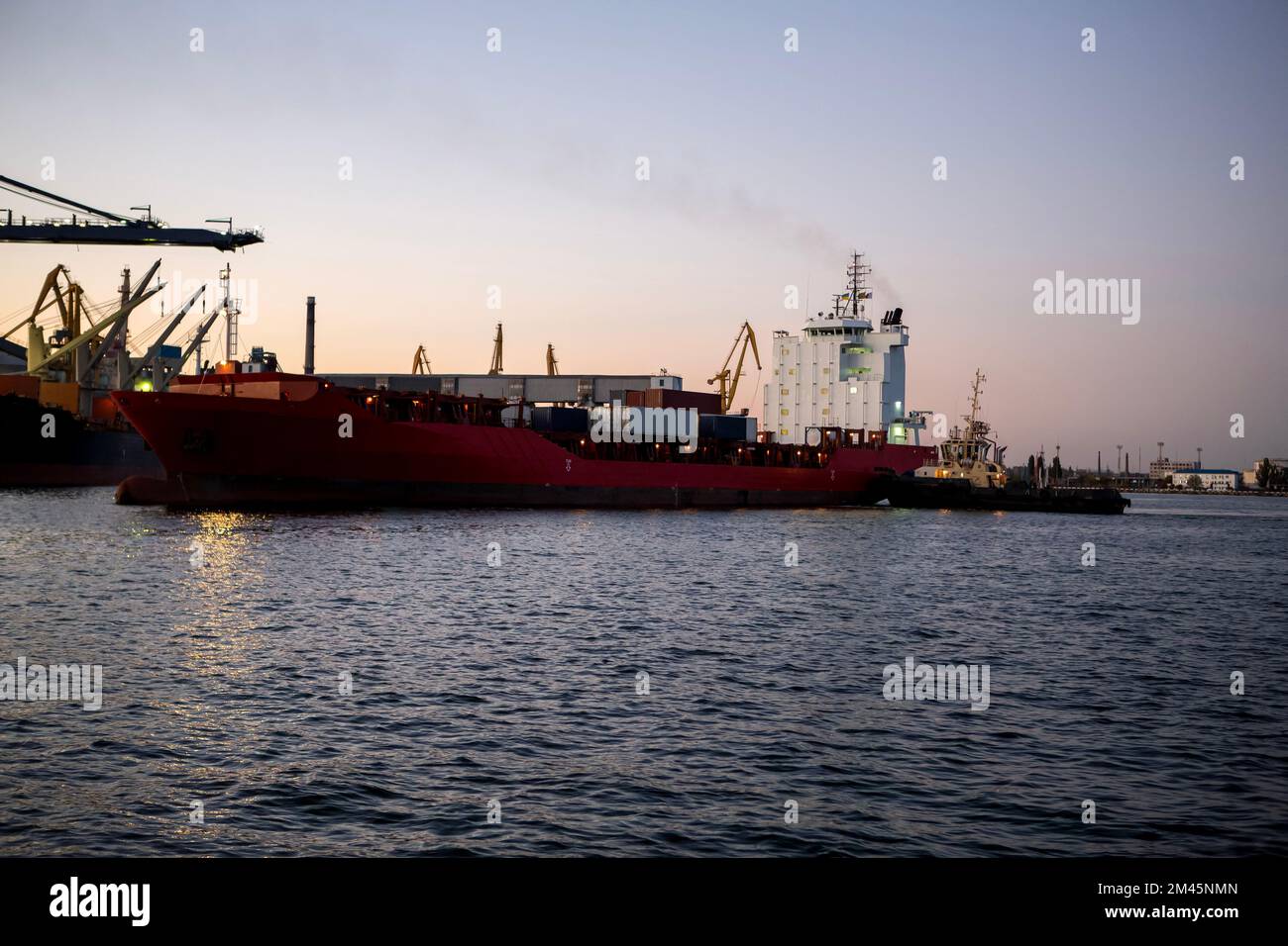 Vessel dry cargo on loading, unloading in port. Bulker in port Stock Photo - Alamy
