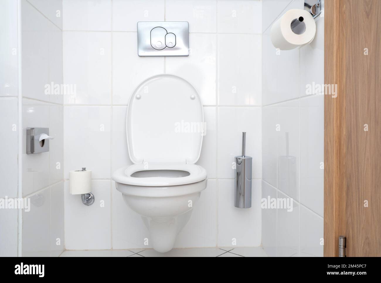 Interior of toilet with white ceramic toilet bowl. Modern minimal style ...